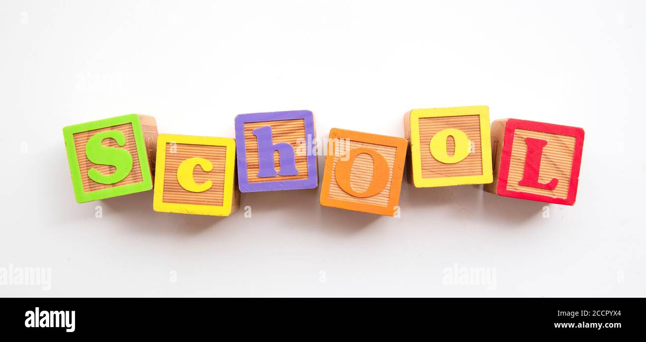 School word made from colourful wooden baby development blocks Stock ...