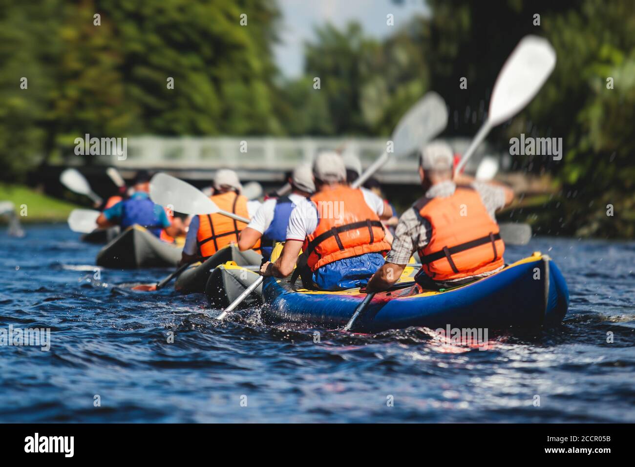A process of kayaking in the city river canals, with colorful canoe ...