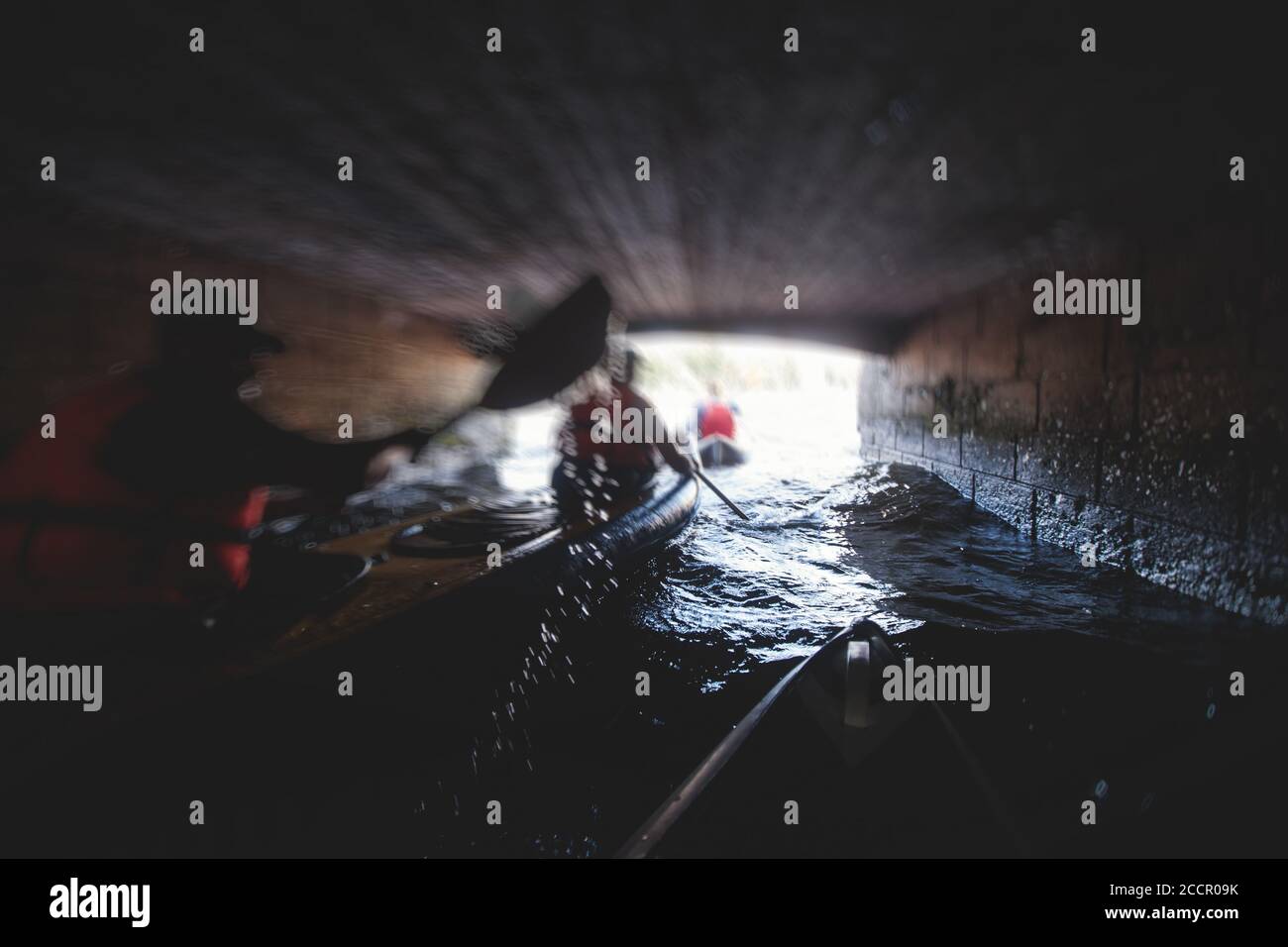 A process of kayaking in the city river canals, with colorful canoe ...