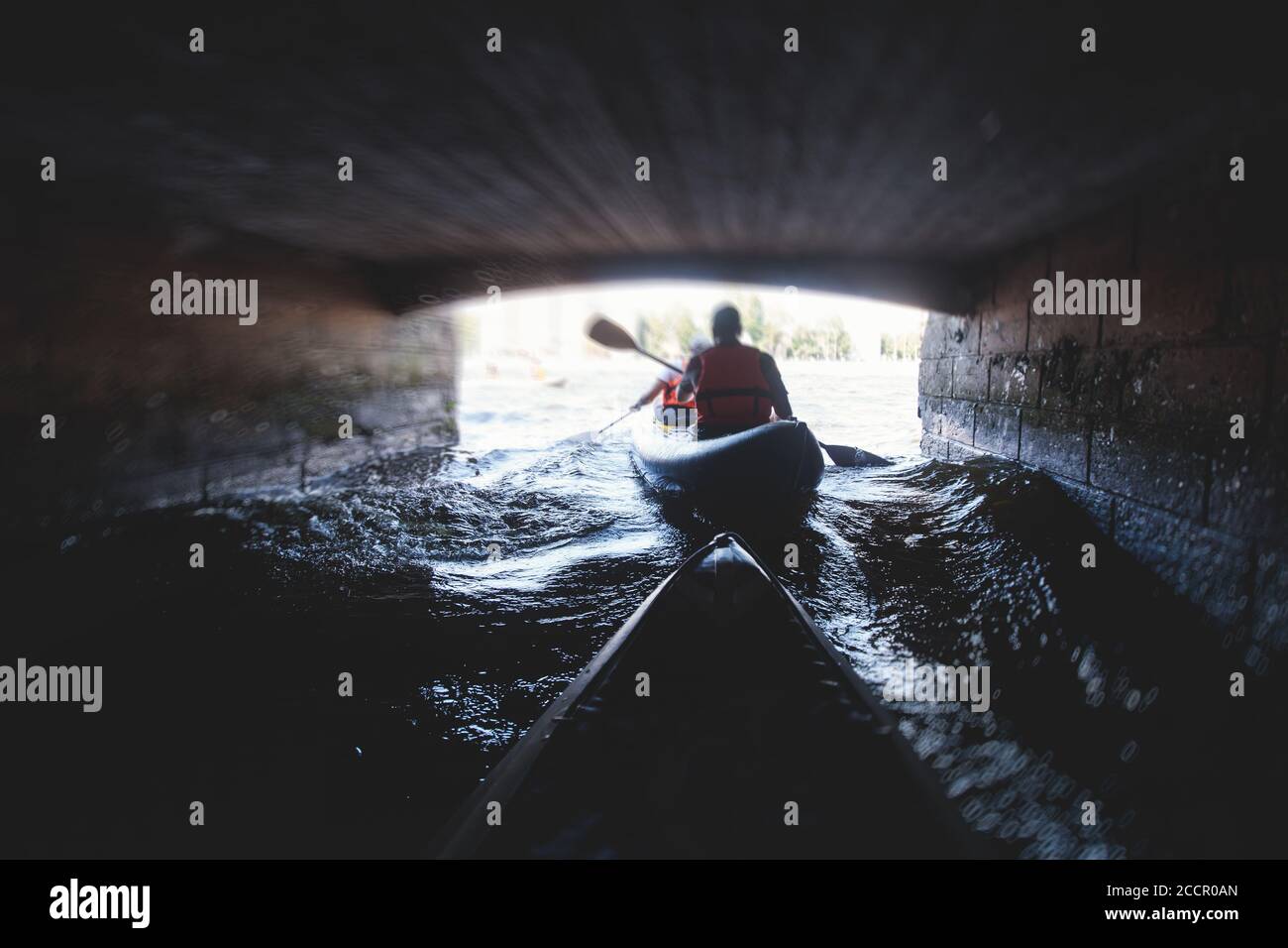 A process of kayaking in the city river canals, with colorful canoe ...
