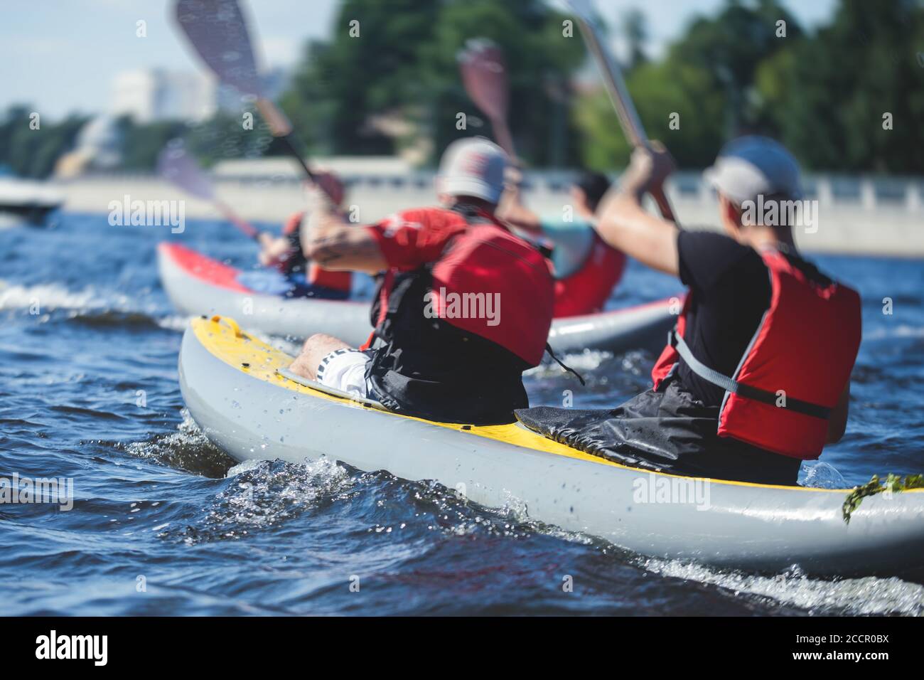 A process of kayaking in the city river canals, with colorful canoe ...