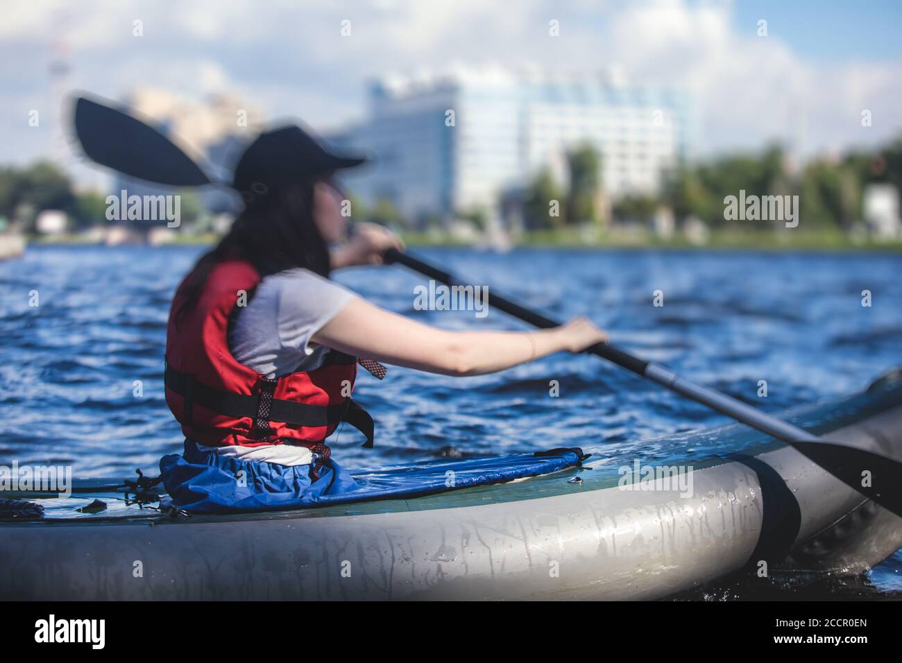 A process of kayaking in the city river canals, with colorful canoe ...