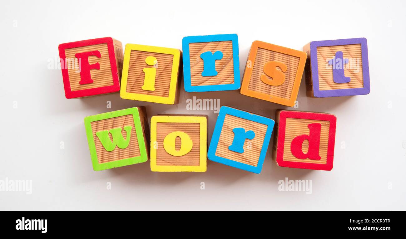 First word word made from colourful wooden baby development blocks ...