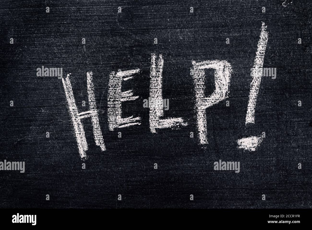 Help message written in chalk on school blackboard, cry for help Stock ...