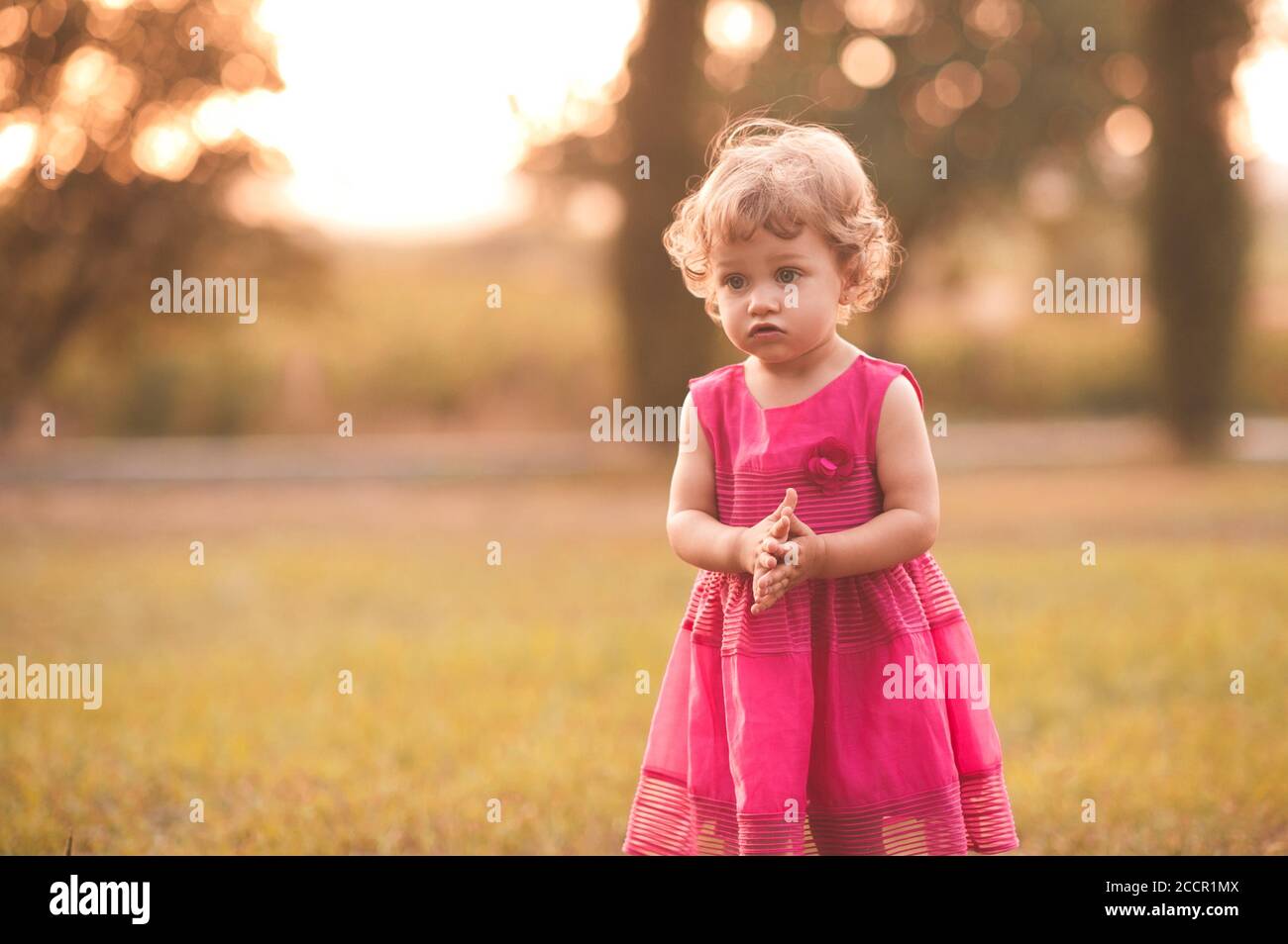 Pretty little child girl 1-2 year old wearing pink princess dress ...
