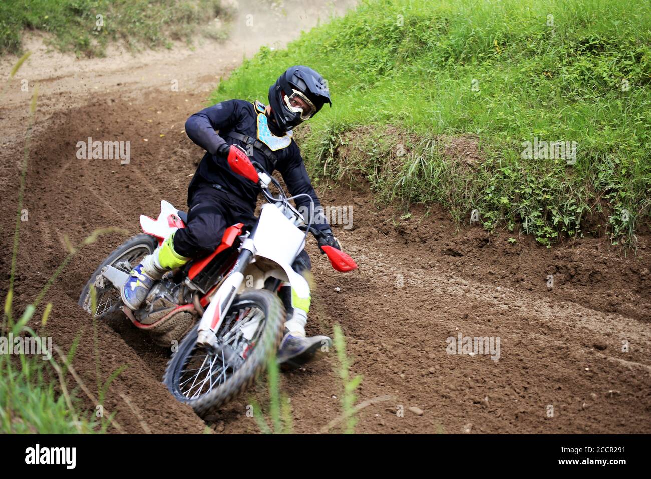 Motocrosser in action Stock Photo - Alamy
