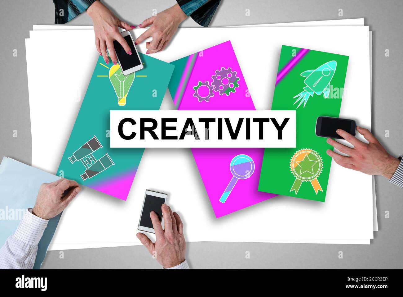 Creativity concept placed on a desk with hands using smartphones Stock ...