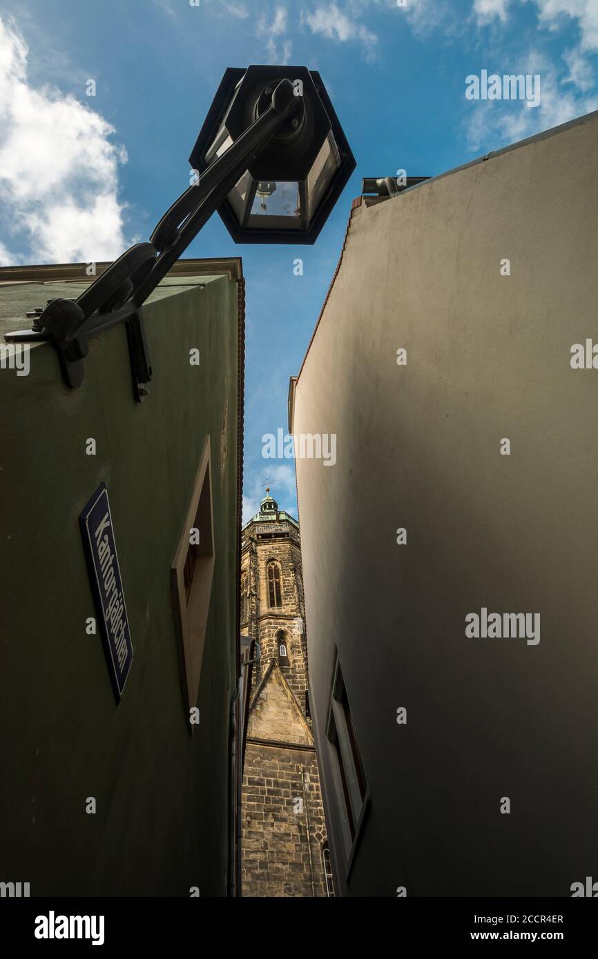 View on a church between buildings Stock Photo - Alamy