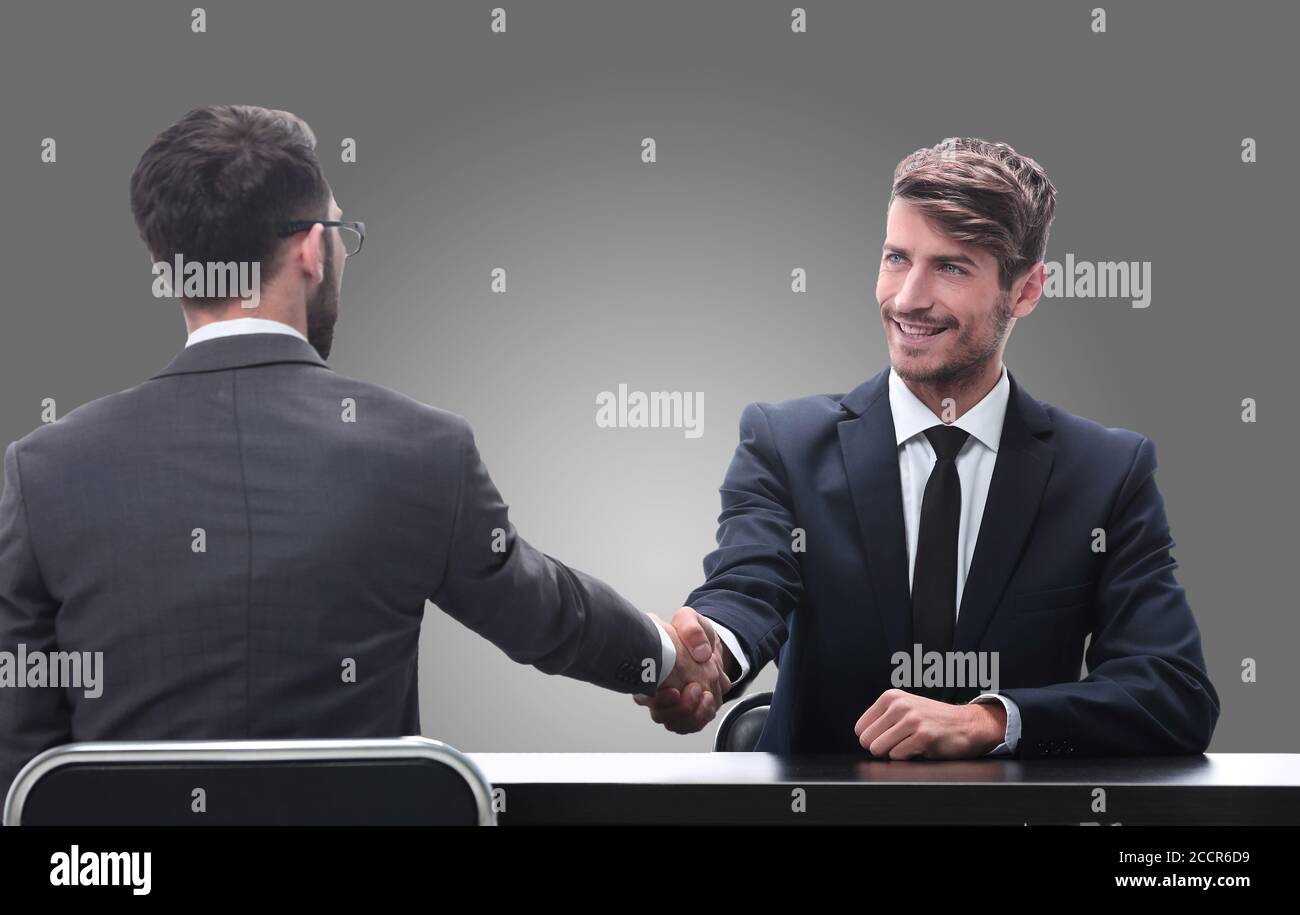 handshake business people sitting at the table Stock Photo - Alamy