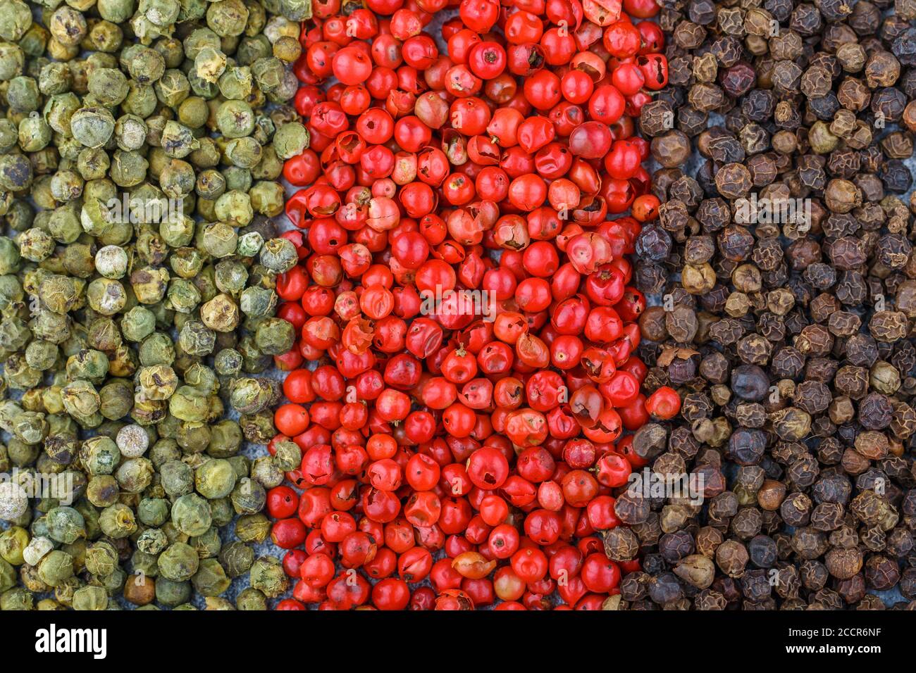 Pink, green and black pepper. Organic dried Peppercorns close-up ...