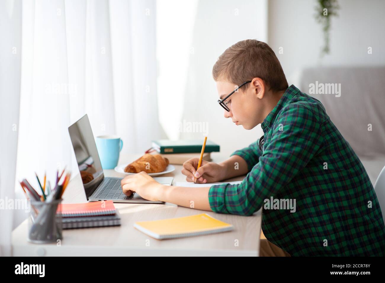 Teen boy glasses working on hi-res stock photography and images - Alamy