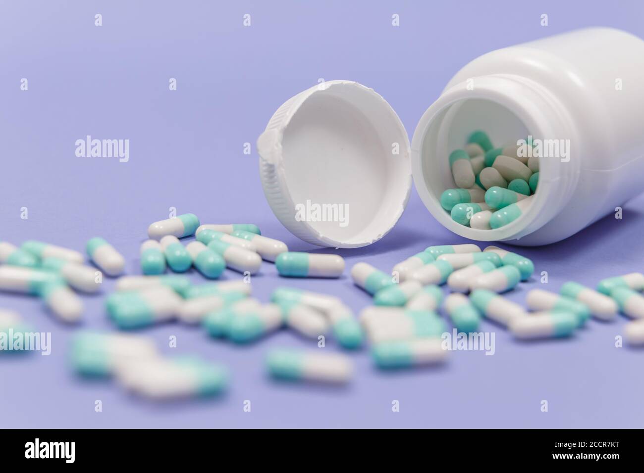 Pills spilling out of pill bottle. Pharmaceutical industry. Pharmacy ...