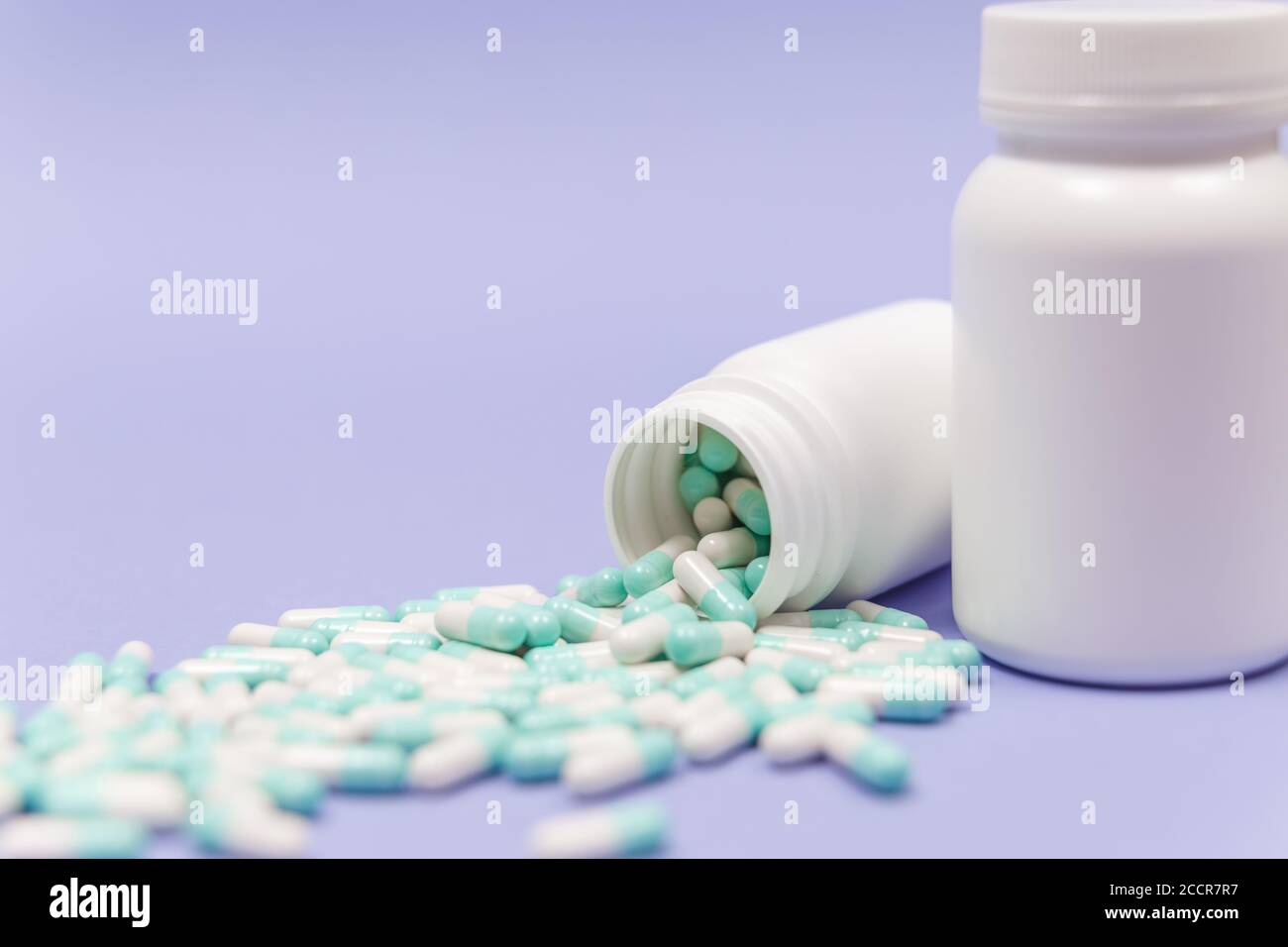 Pills spilling out of pill bottle. Pharmaceutical industry. Pharmacy ...