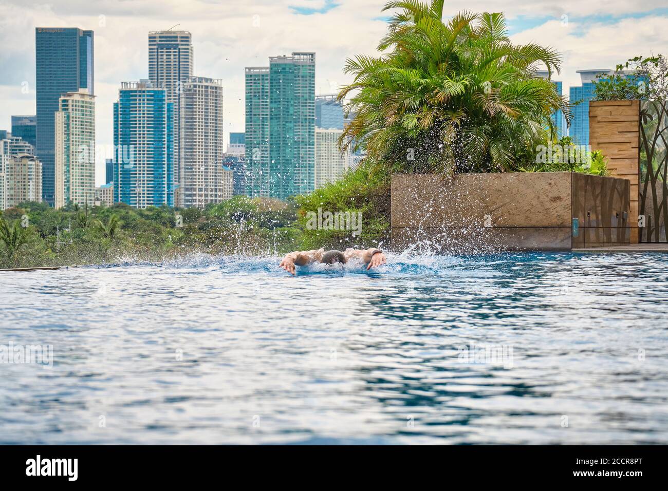 Manila, Philippines - Feb 02, 2020. A man swims a butterfly in a pool ...