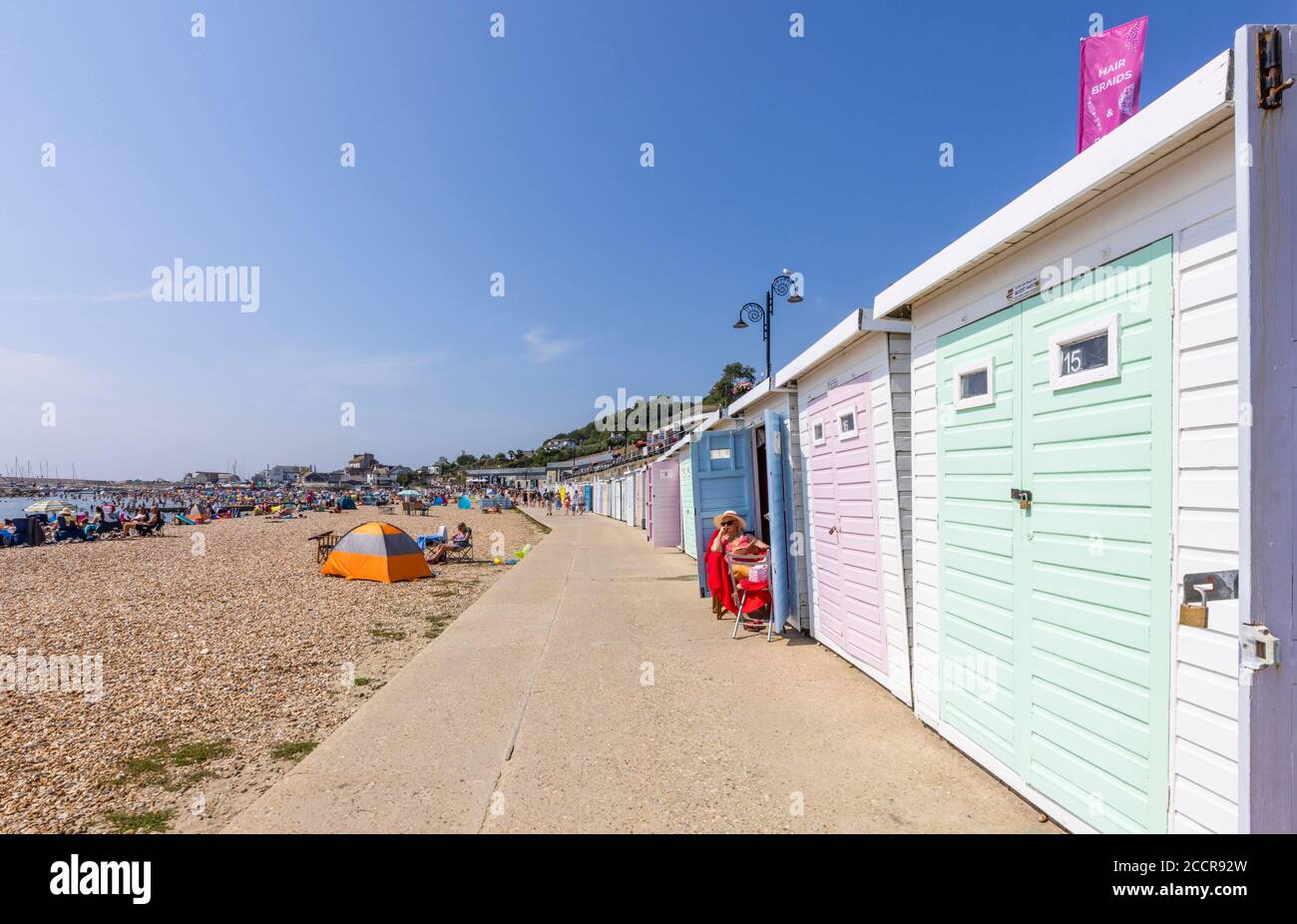 Beach huts along Marine Parade promenade in Lyme Regis, a popular ...