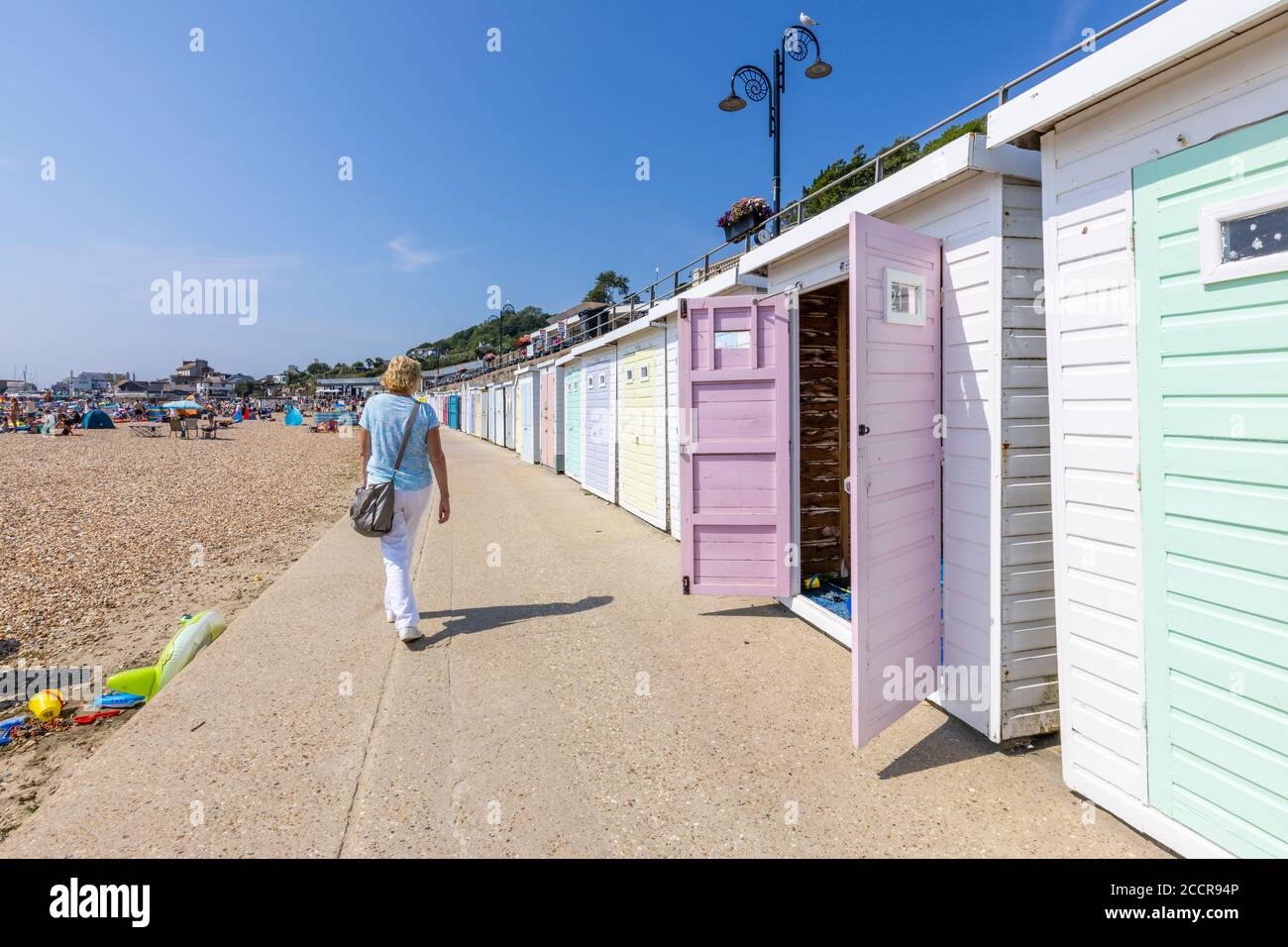 Beach huts along Marine Parade promenade in Lyme Regis, a popular ...