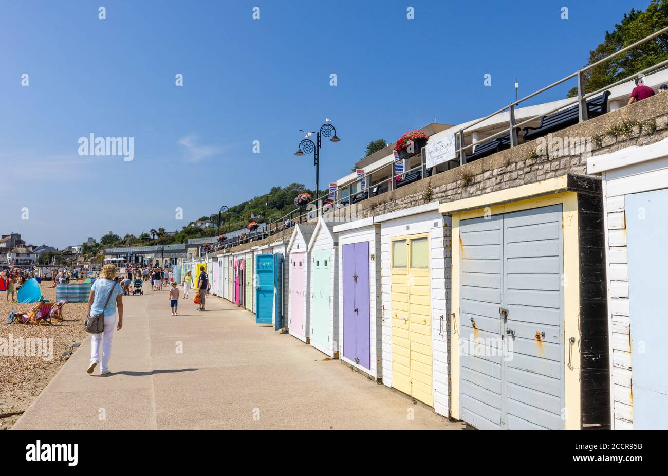 Beach huts along Marine Parade promenade in Lyme Regis, a popular ...