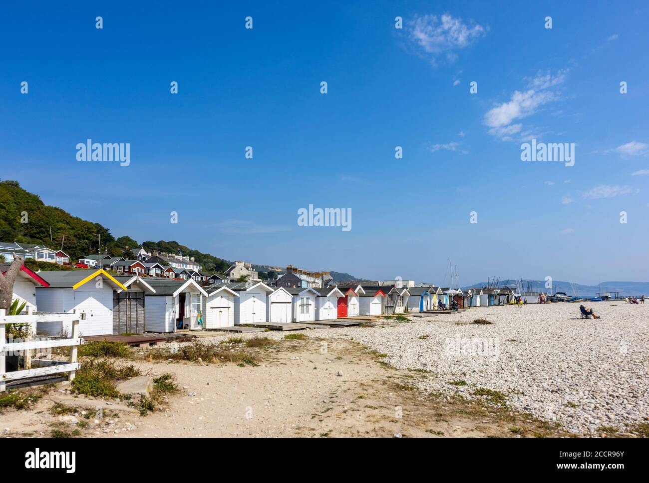 Beach huts on the shore at Monmouth Beach west of Lyme Regis, a popular ...
