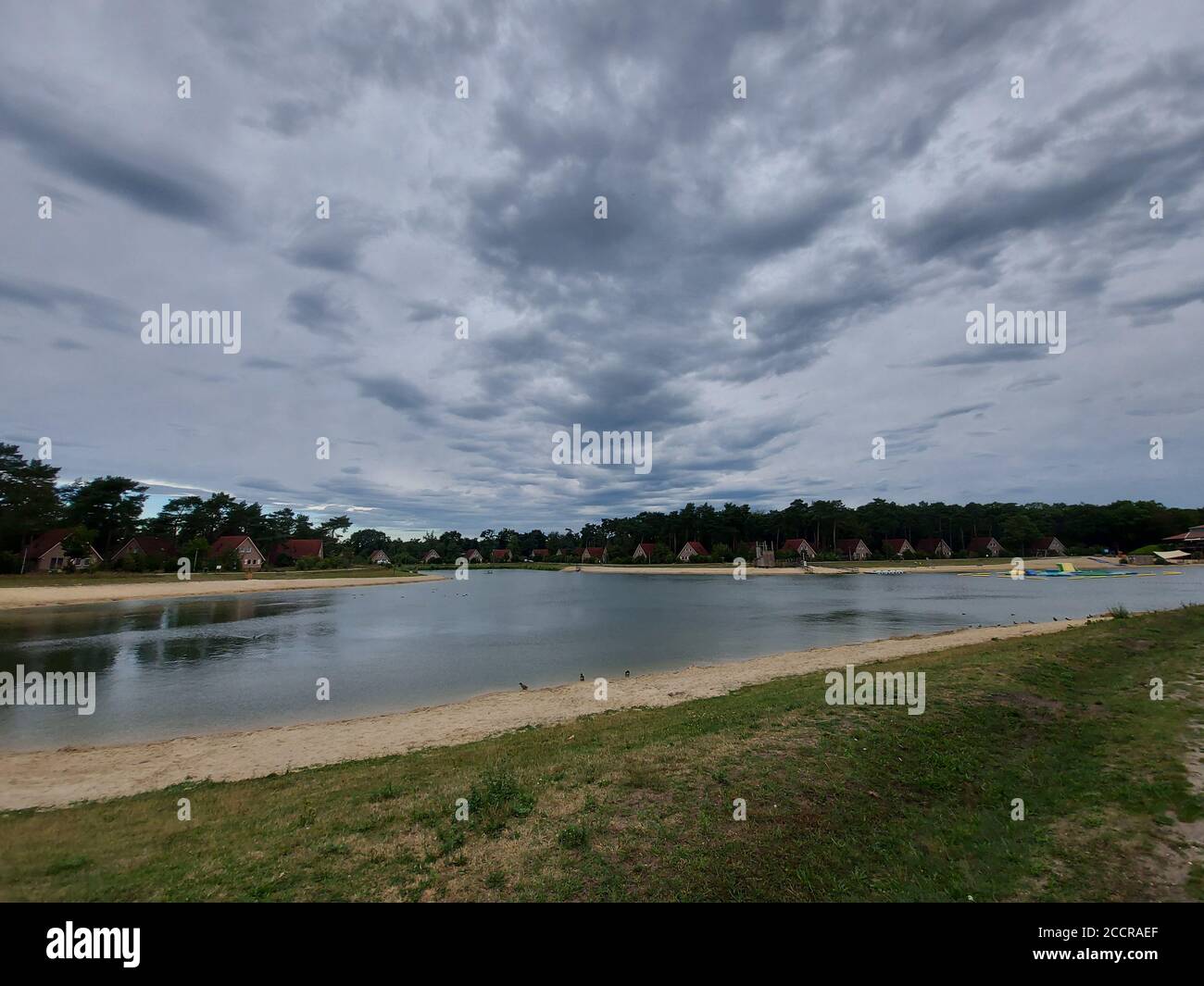 Dark Stratocumulus clouds above a lake bringing rain at end of the ...