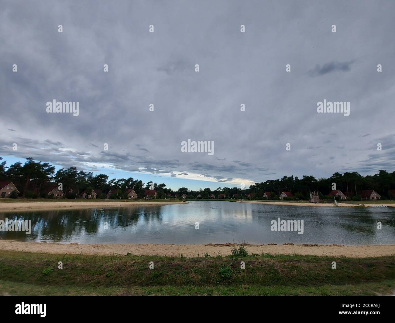Dark Stratocumulus clouds above a lake bringing rain at end of the ...