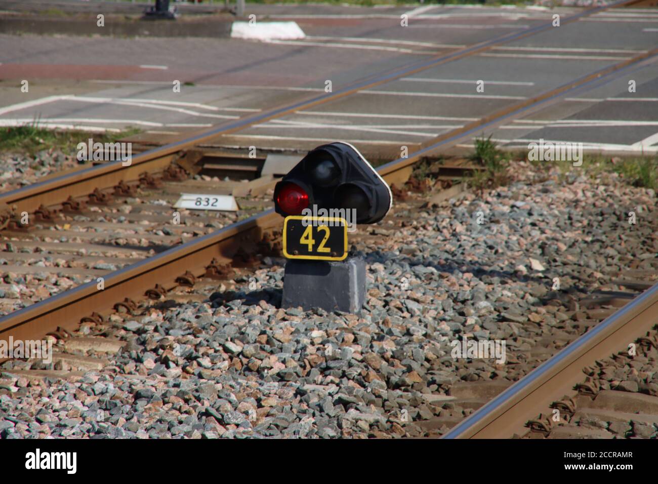 Red sign along the railroad track to stop trains in the Netherlands at ...
