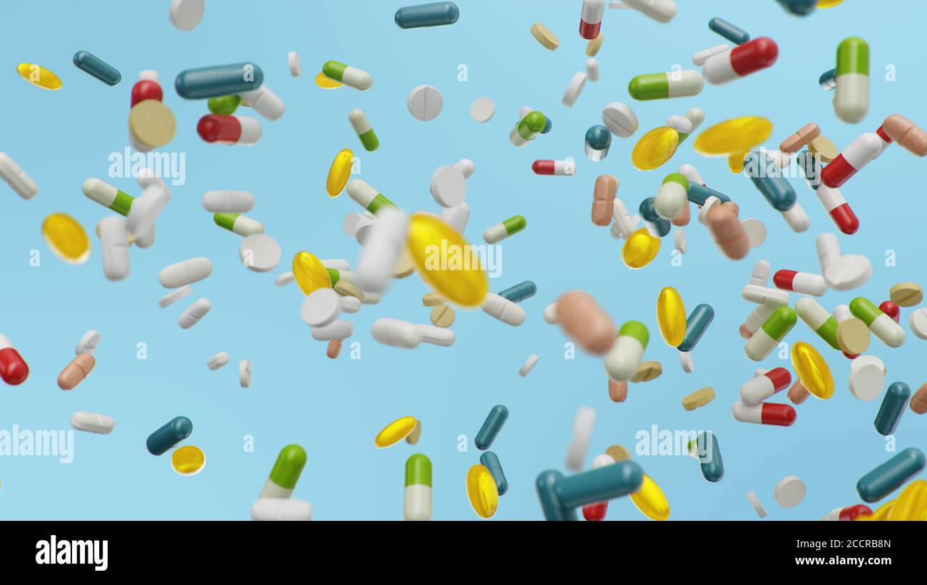 Flying, falling pills. different colored tablets, capsules. Health care ...