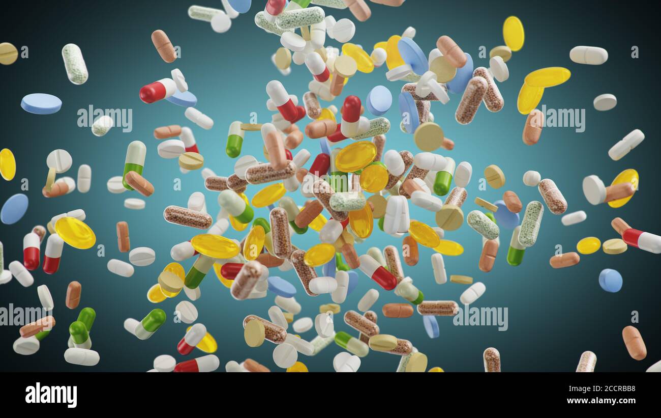 Flying, falling pills. different colored tablets, capsules. Health care ...