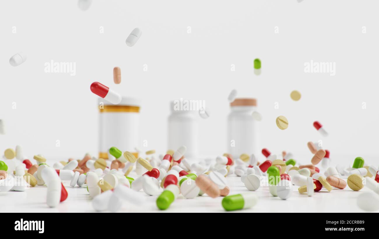 Pills on the floor with jars, different colored tablets, capsules ...