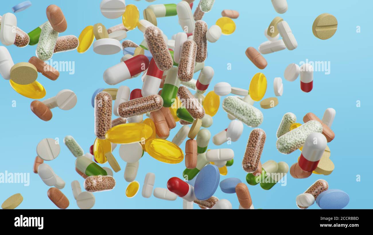 Flying, falling pills. different colored tablets, capsules. Health care ...