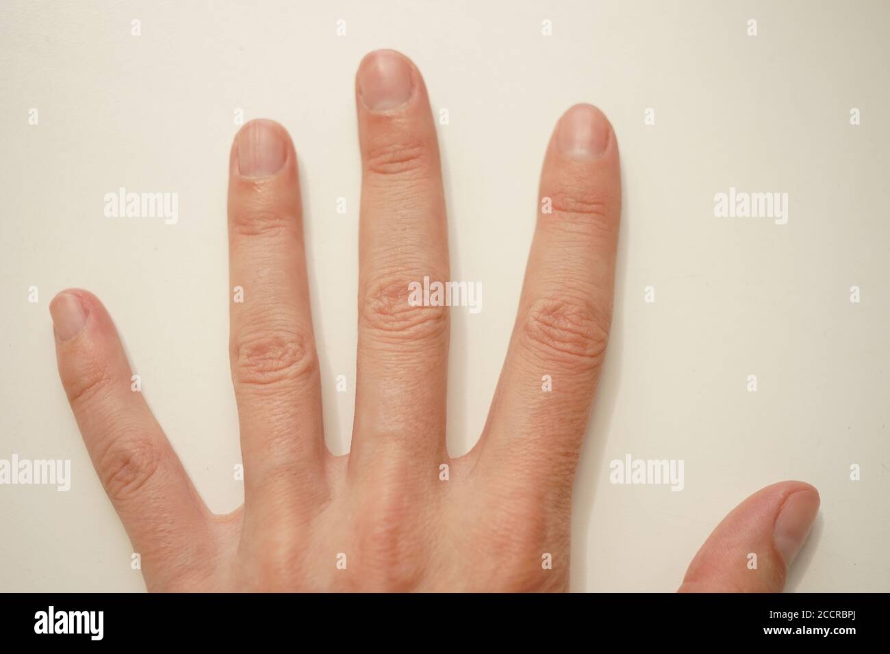 Young female hand with spreaded fingers on the wall Stock Photo - Alamy