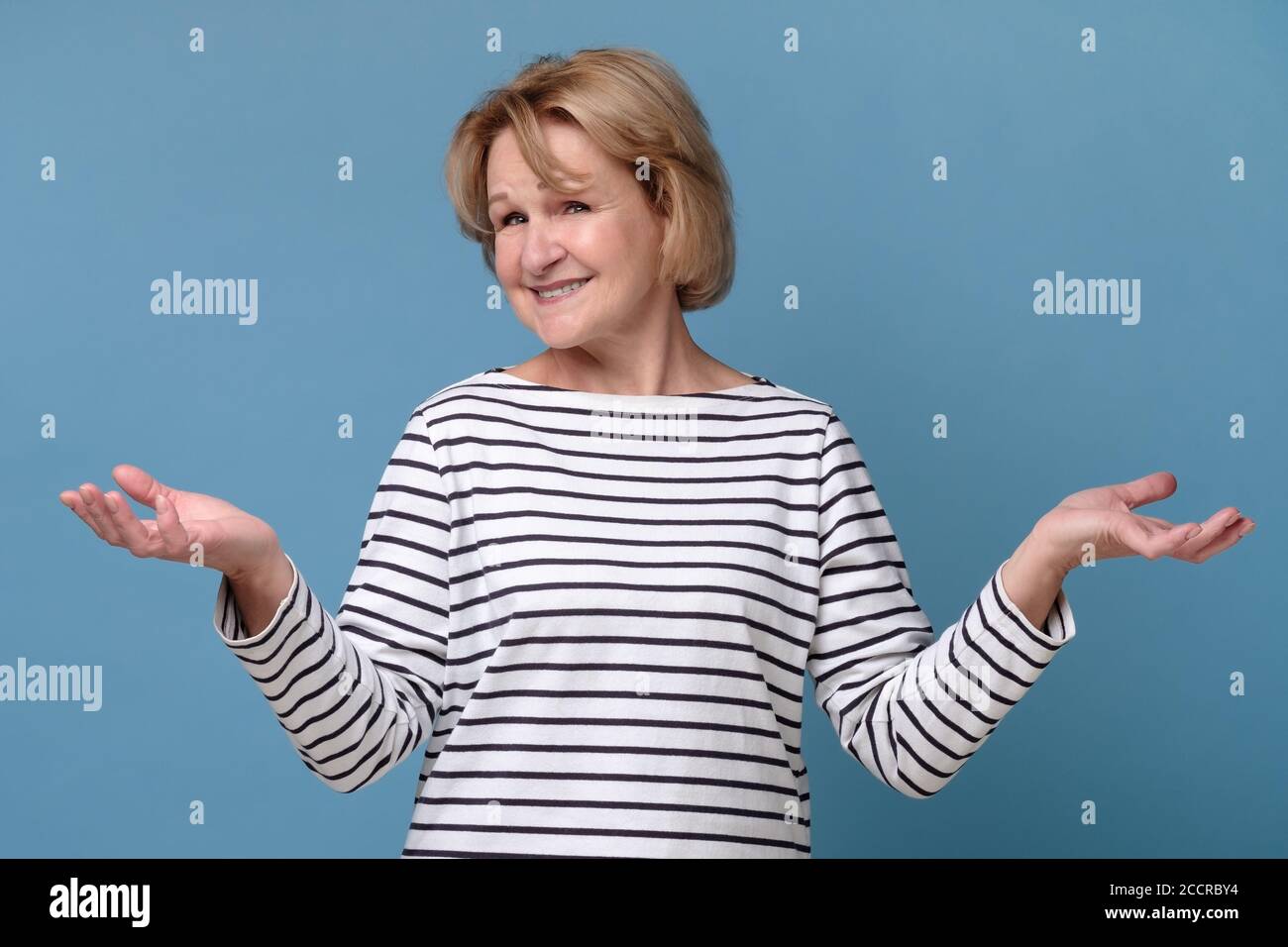 Senior caucasian woman choosing between two options Stock Photo - Alamy