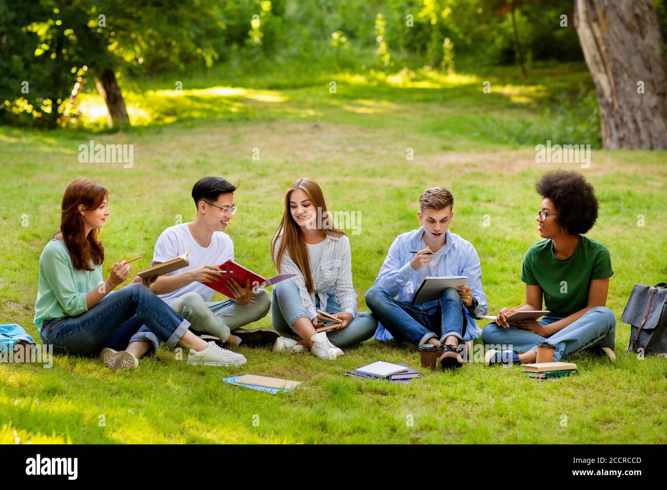 Education Concept. Group of multiethnic students preparing for lectures ...