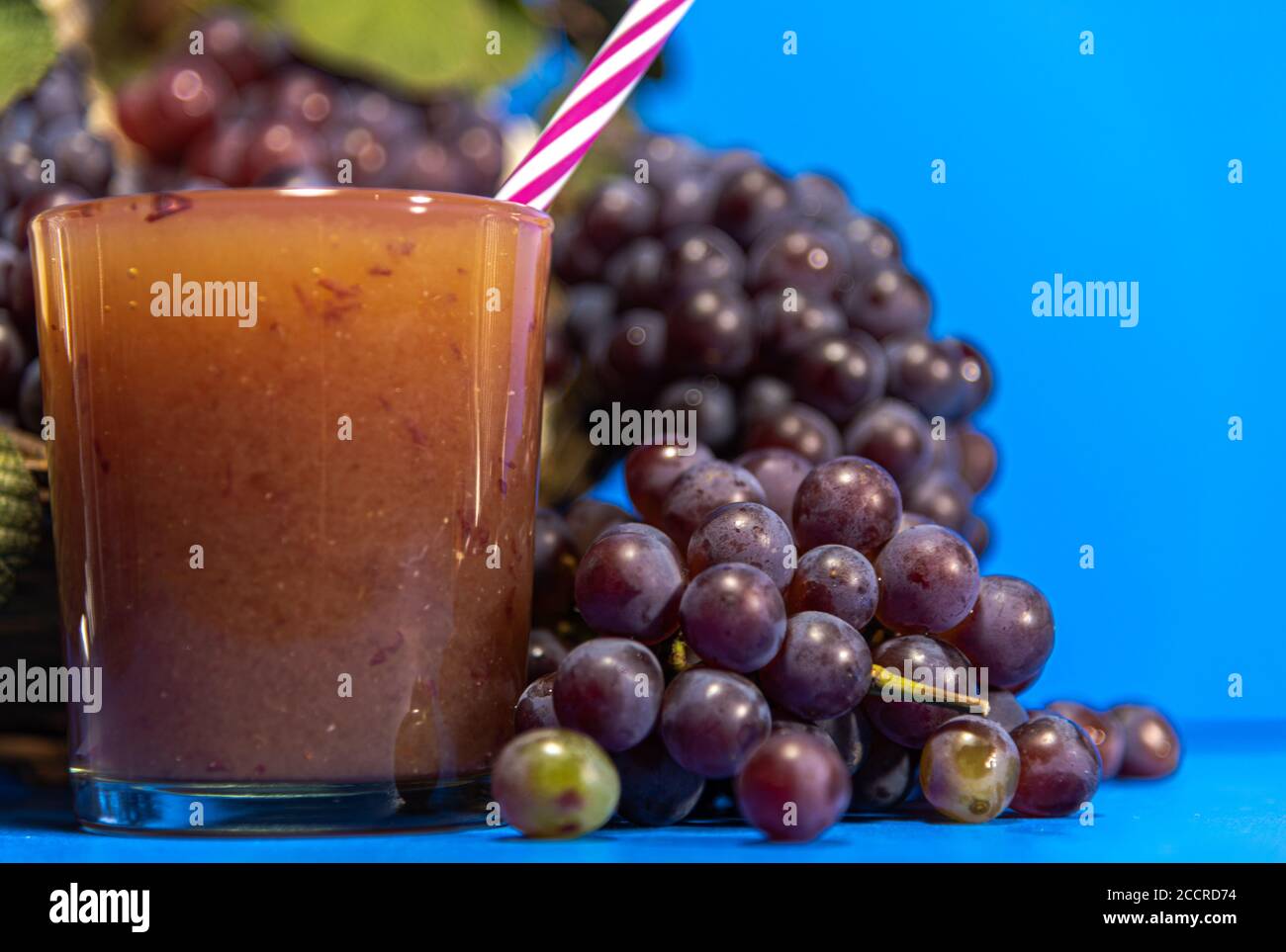 Grape juice in a glass. Bunches of grape of the niagara species (Vitis ...