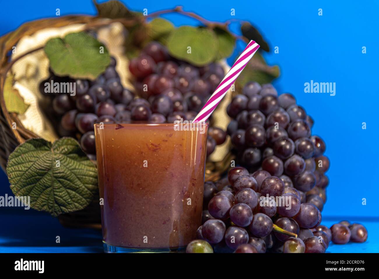 Grape juice in a glass. Bunches of grape of the niagara species (Vitis ...
