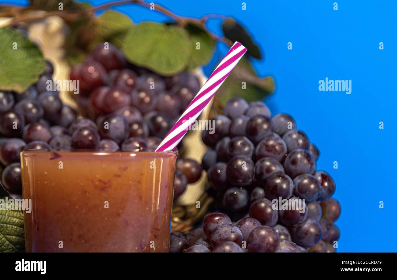 Grape juice in a glass. Bunches of grape of the niagara species (Vitis ...