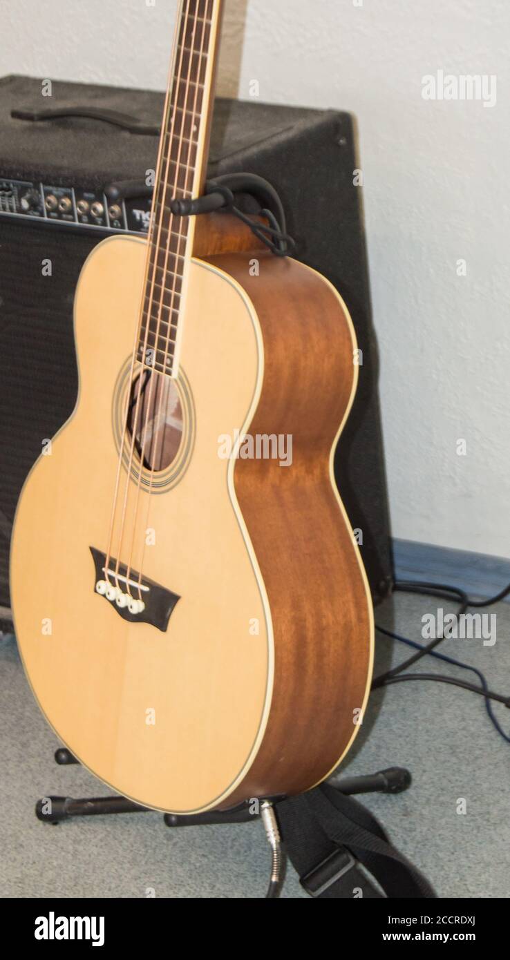 Acoustic concert guitar on stage, musical instrument Stock Photo - Alamy
