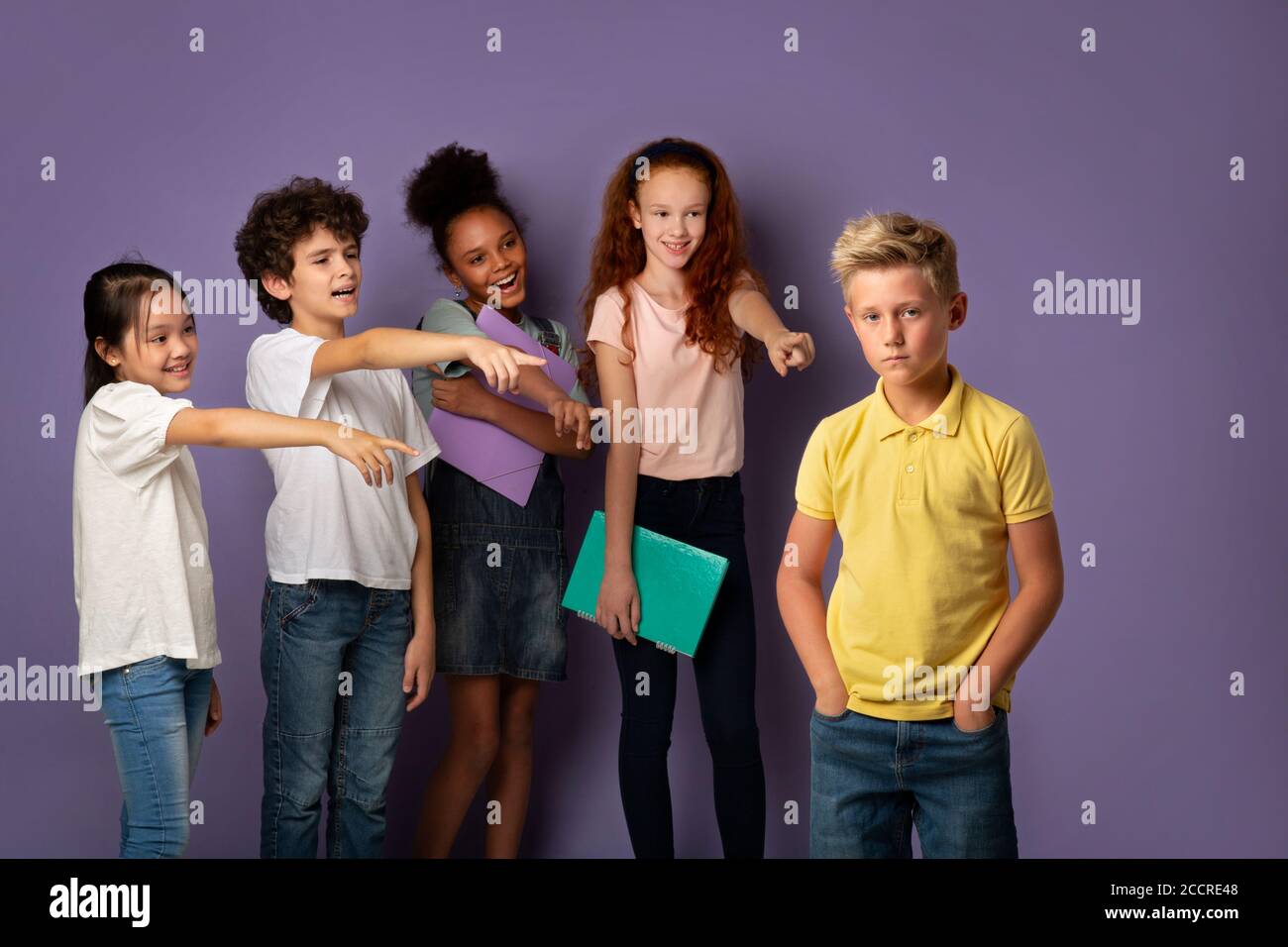 Stop bullying at schools. Vicious kids laughing at sad blonde boy over ...