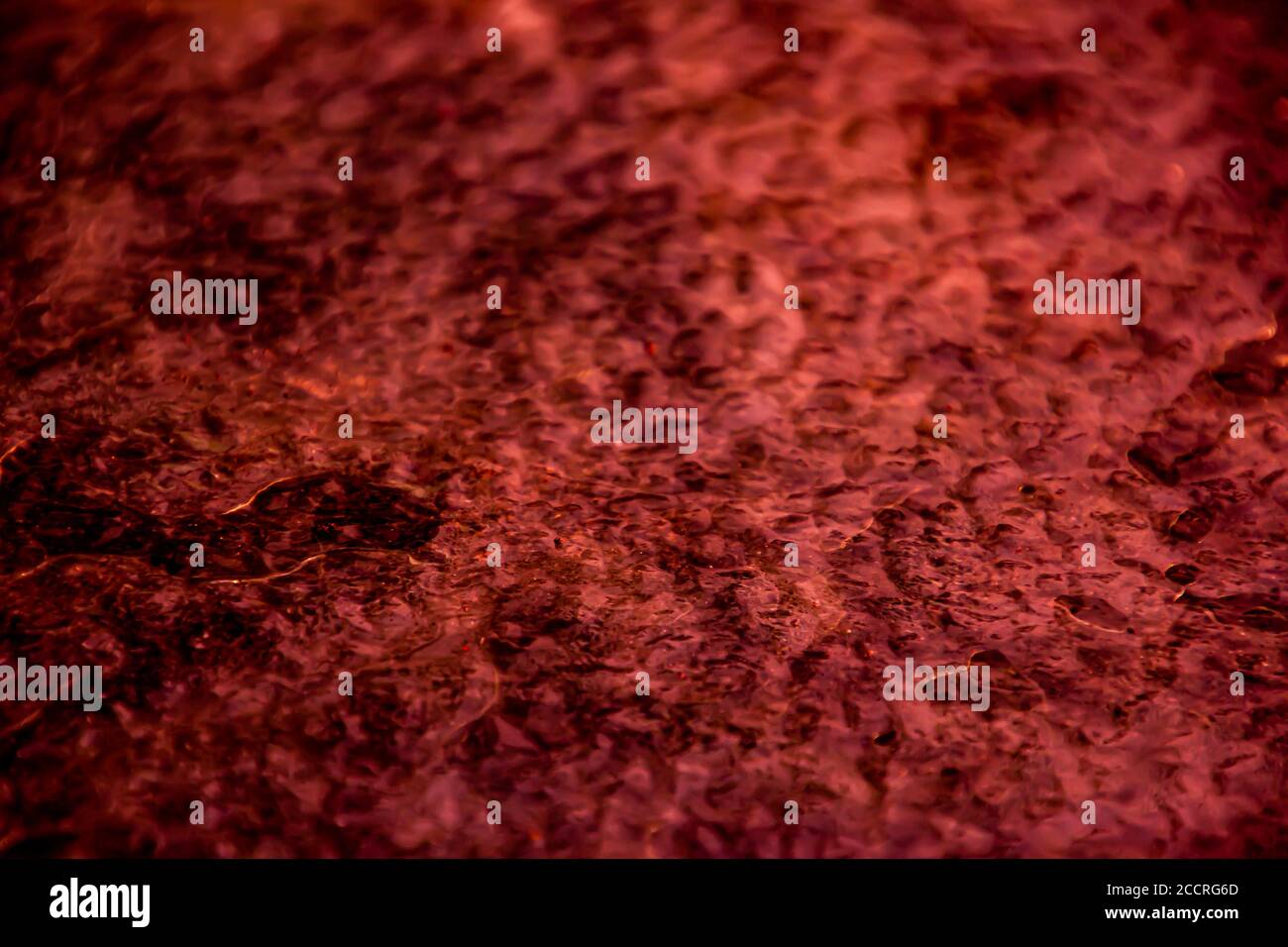 Crimson red colored abstract texture background with textures of ...