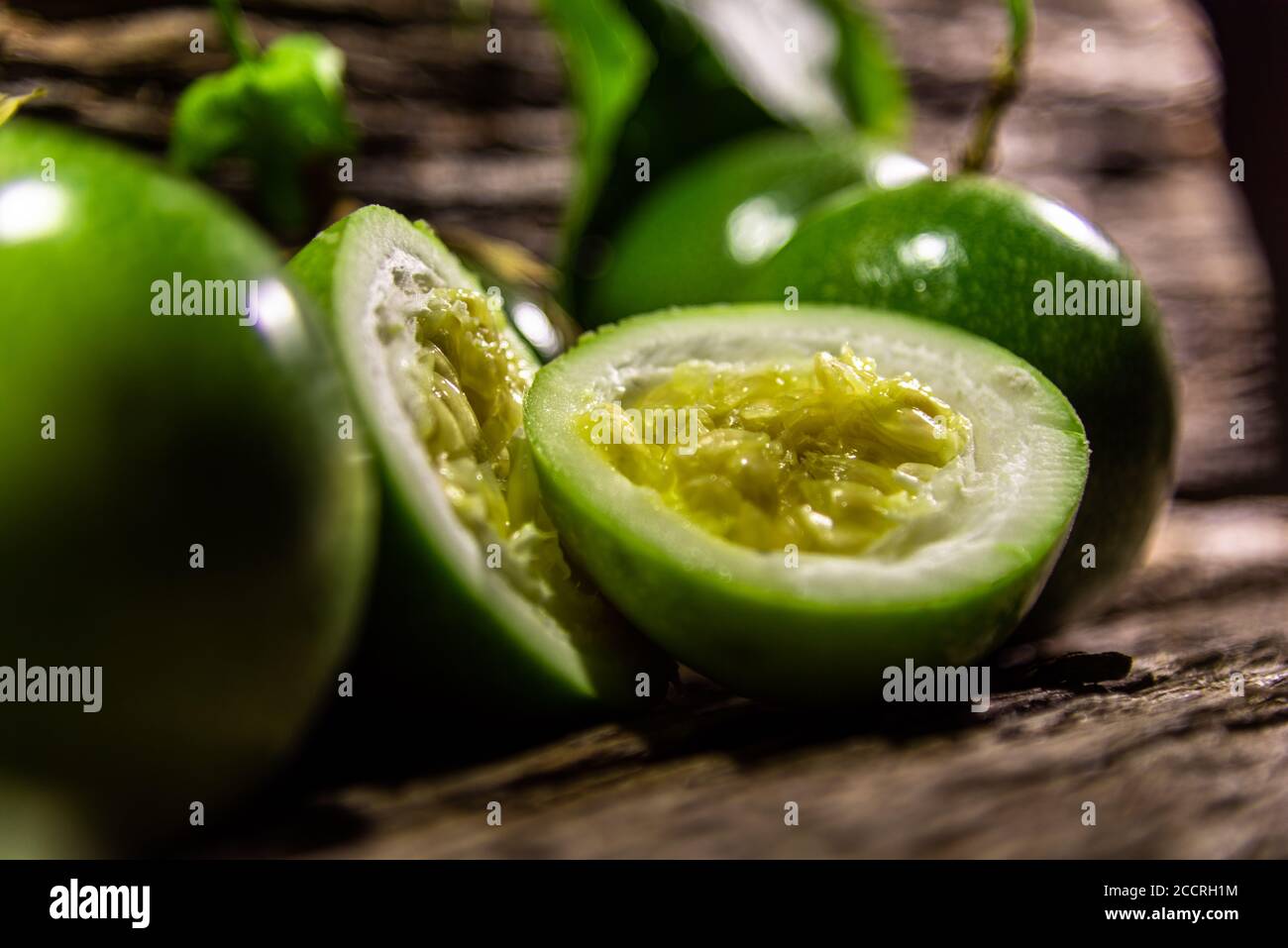 Passion fruit and pulp. Passiflora edulis is a semi-woody climbing ...