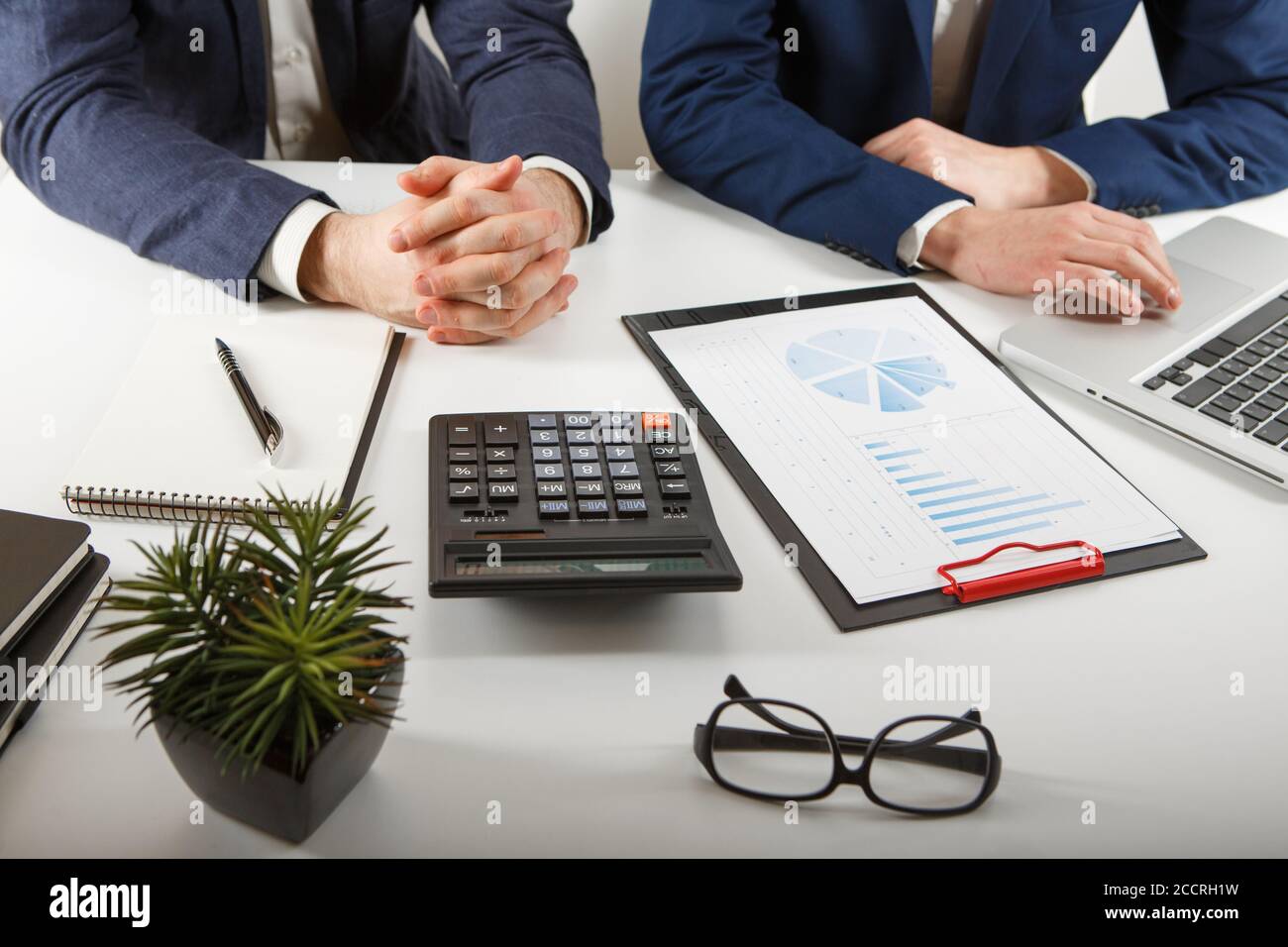 Business people discussing the charts and graphs showing Stock Photo ...