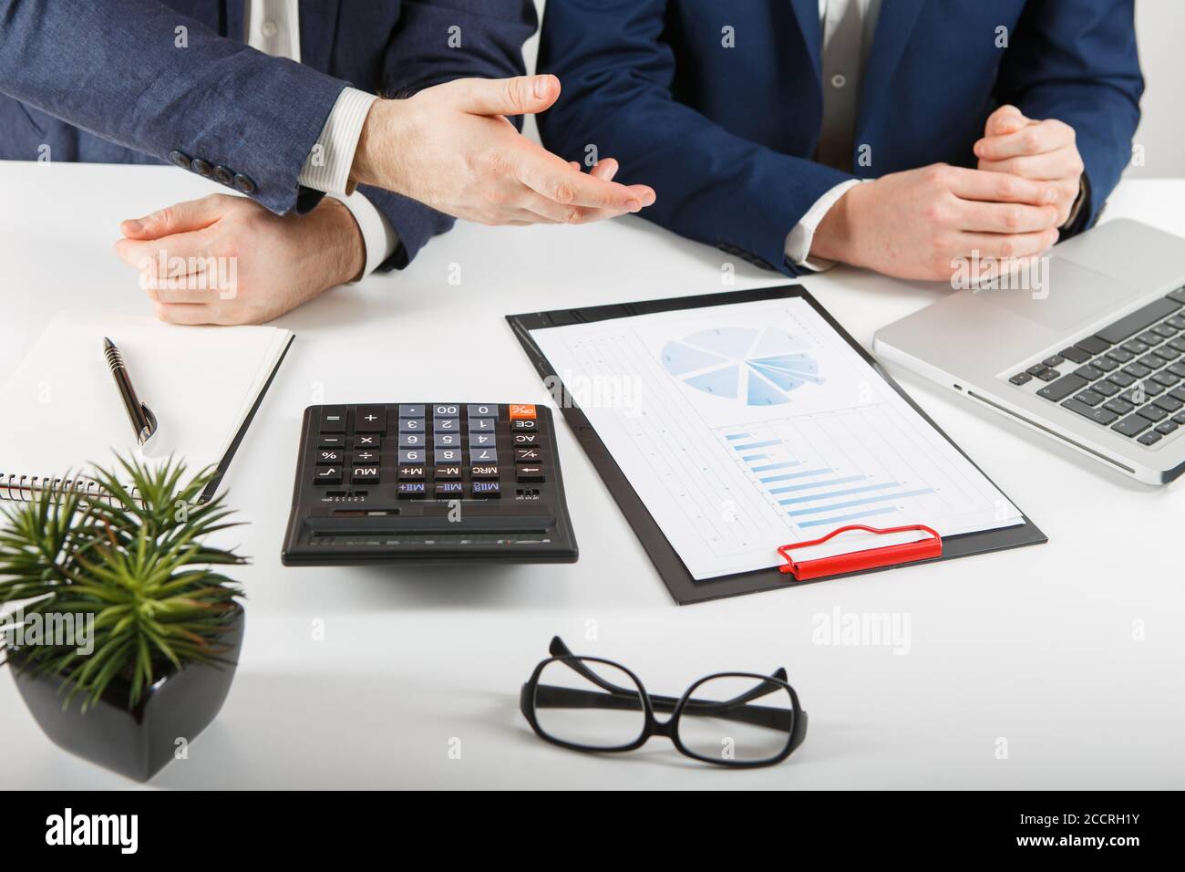 Business people discussing the charts and graphs showing Stock Photo ...