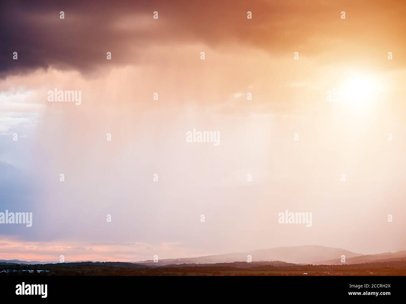 Dramatic and colorful rainy sky with sun Stock Photo - Alamy