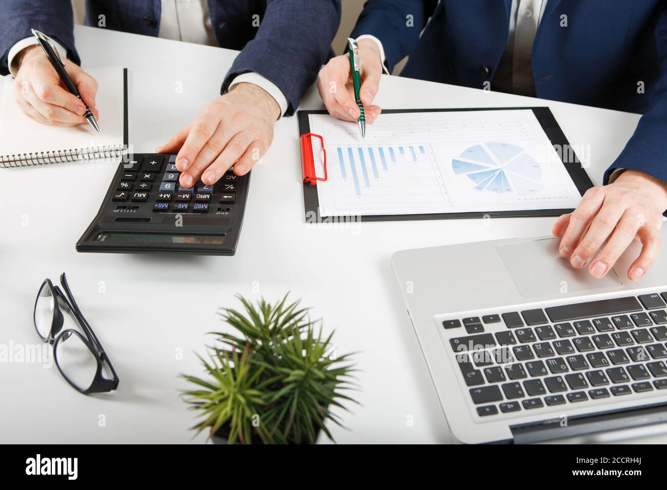 Business people discussing the charts and graphs showing Stock Photo ...