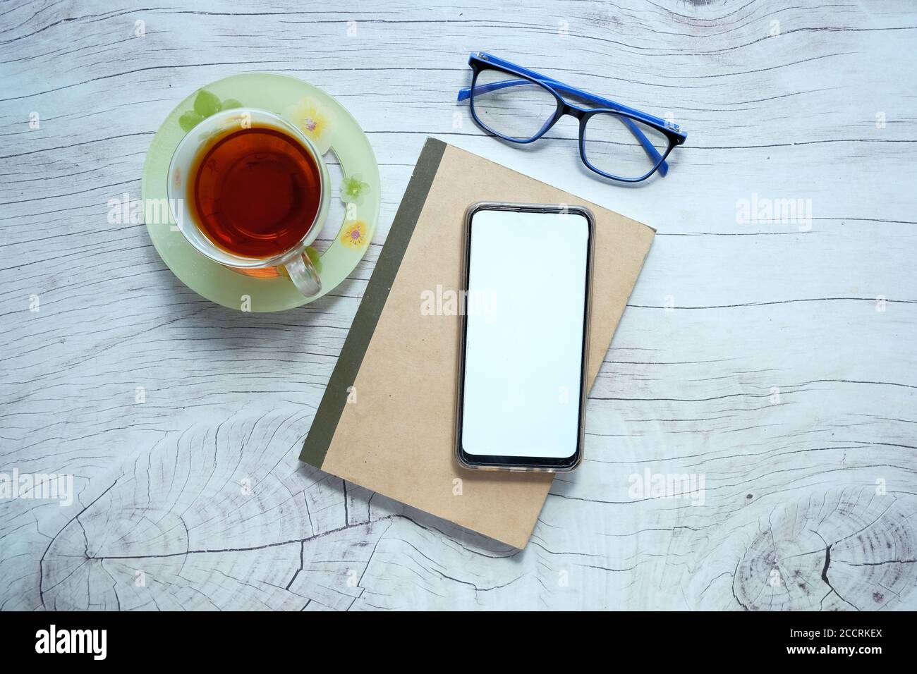 smart phone with empty screen on notepad Stock Photo - Alamy