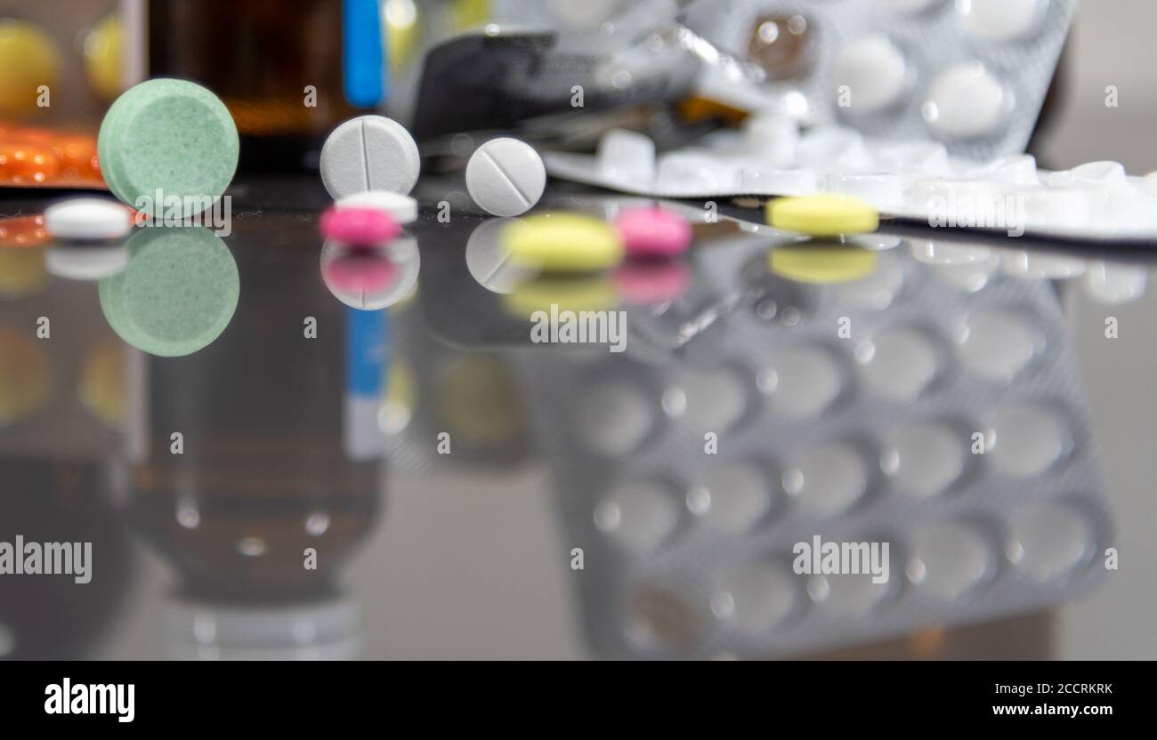 Pills and medicines. Pharmaceutical products. Drugs arranged on a ...