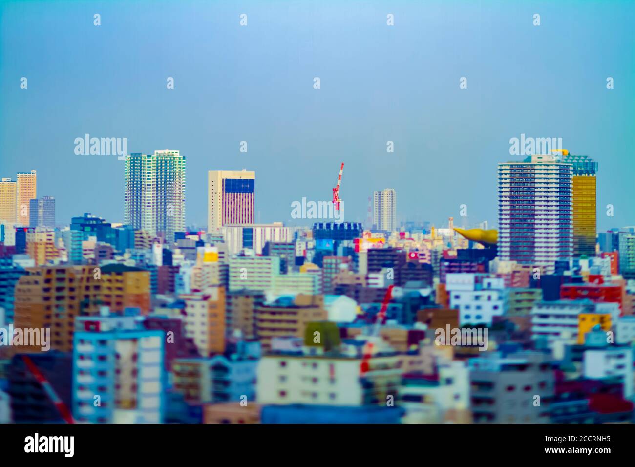 Crane at top of the building in Tokyo tiltshift Stock Photo - Alamy