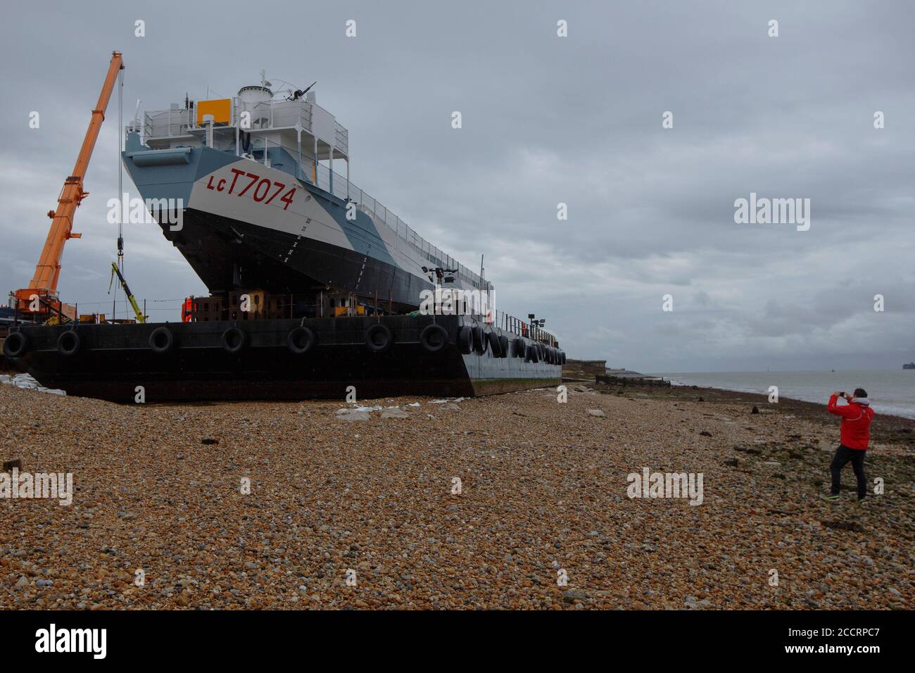 Portsmouth, Hampshire, UK. 24th Aug 2020. A bystander photographs the ...
