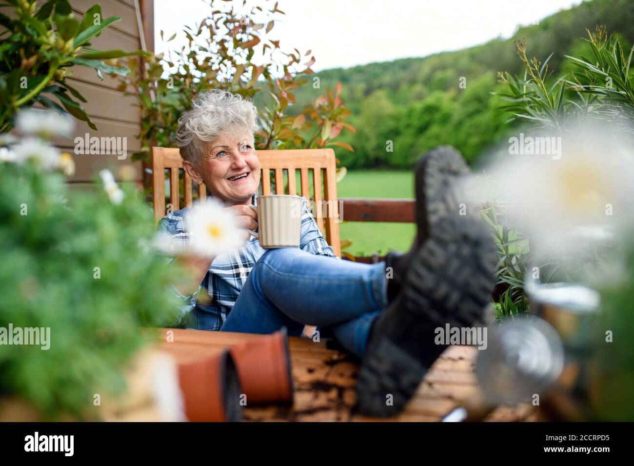 Old woman feet up hi-res stock photography and images - Alamy