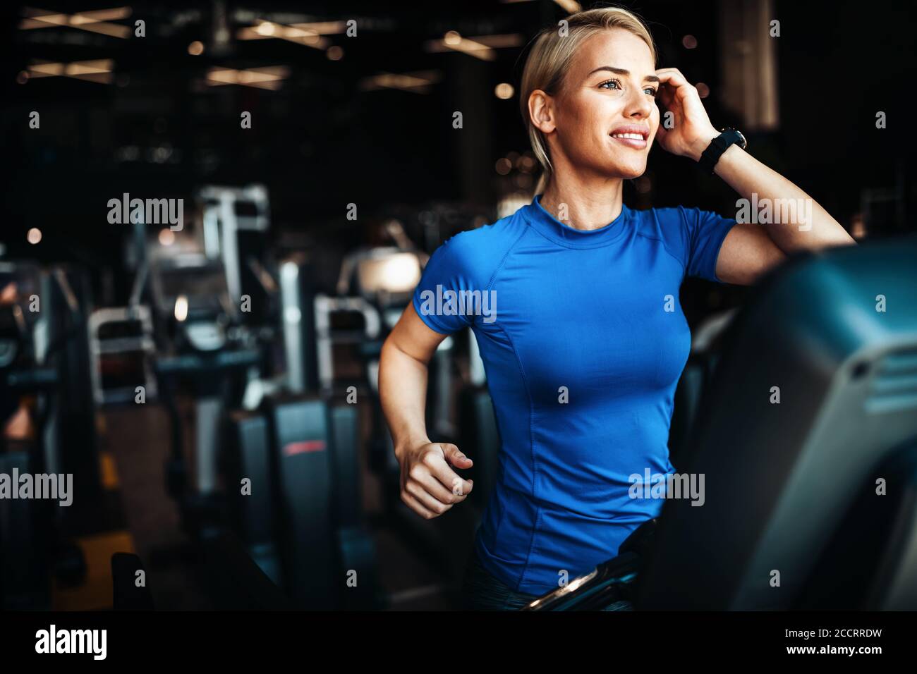 Young attractive woman doing cardio training in gym Stock Photo - Alamy