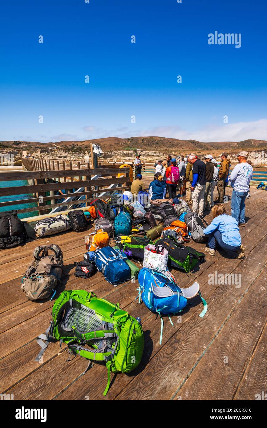 Visitors and gear on the pier at Bechers Bay, Santa Rosa Island ...
